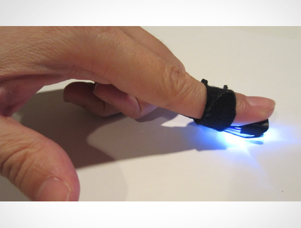 Magic Finger: Always-Available Input through Finger Instrumentation